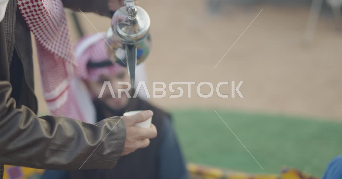 A group of Saudi Gulf Arab friends enjoying a road trip in the Saudi ...