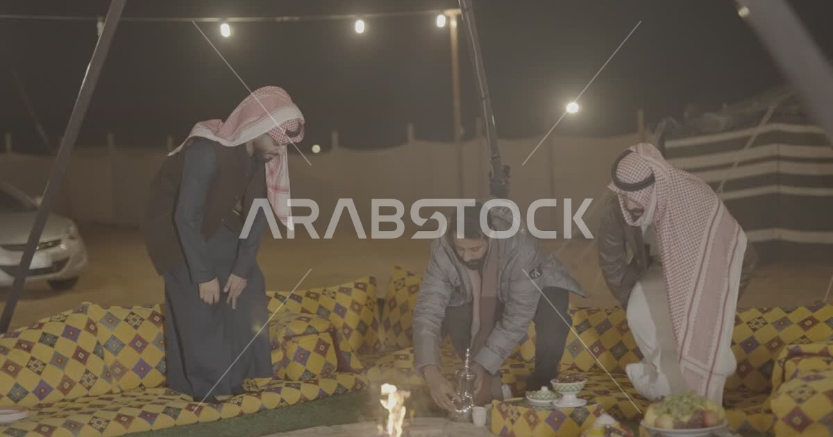 A group of Saudi Gulf Arab friends enjoying a road trip in the Saudi ...