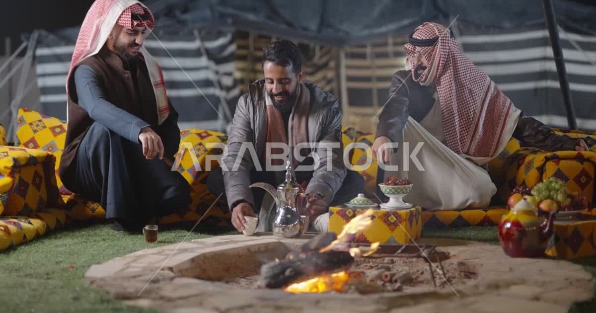 A group of Saudi Gulf Arab friends enjoying a road trip in the Saudi ...