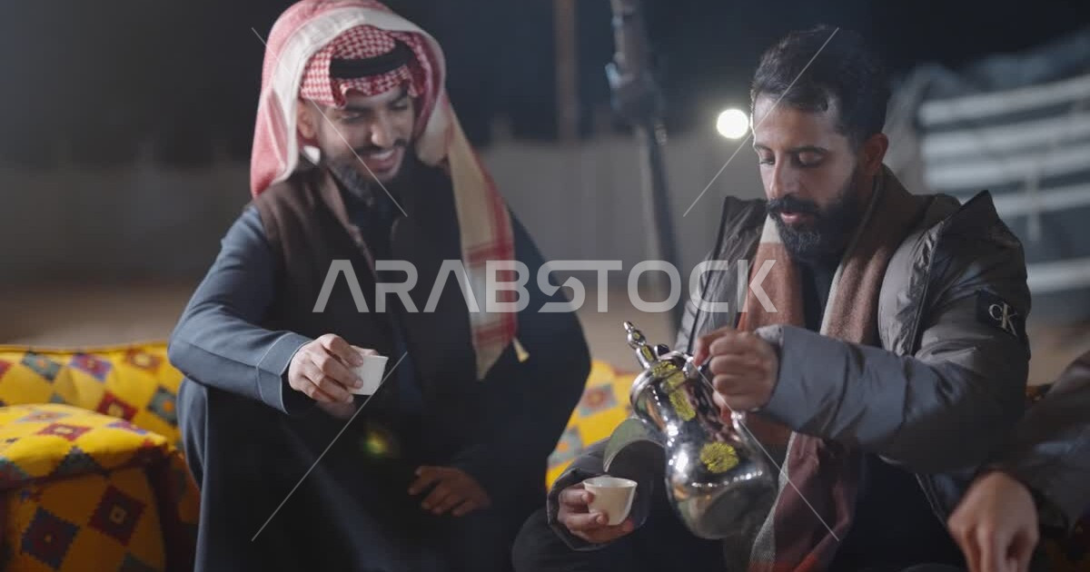A group of Saudi Gulf Arab friends enjoying a road trip in the Saudi ...