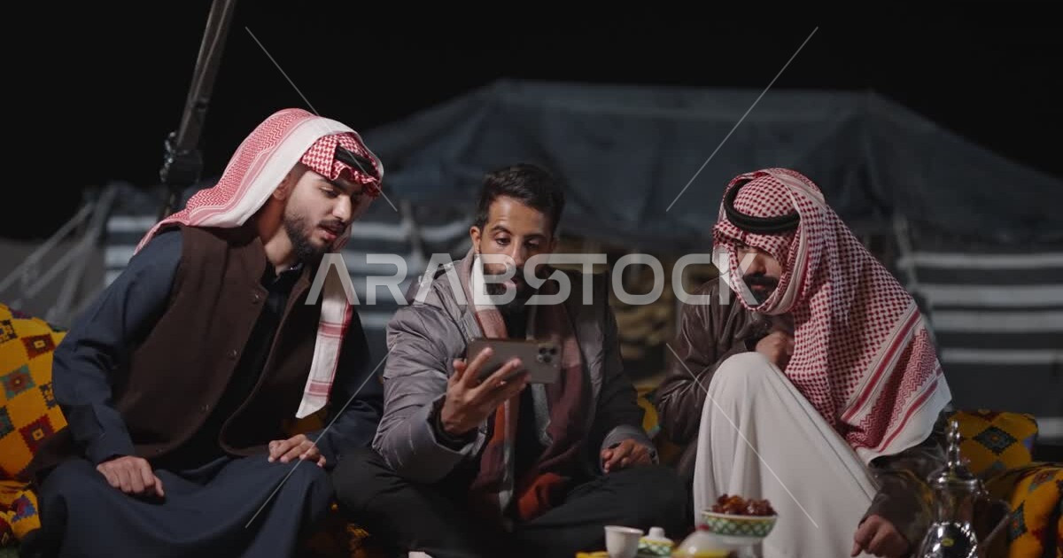 A group of young Saudi Arabian Gulf men enjoying a wild camping trip in ...