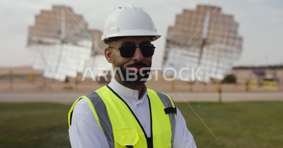Saudi Arabian Gulf engineer, wearing a helmet, protection jacket and ...