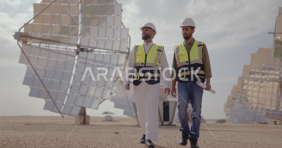 Two Saudi Arabian Gulf solar engineers supervising solar power plants ...