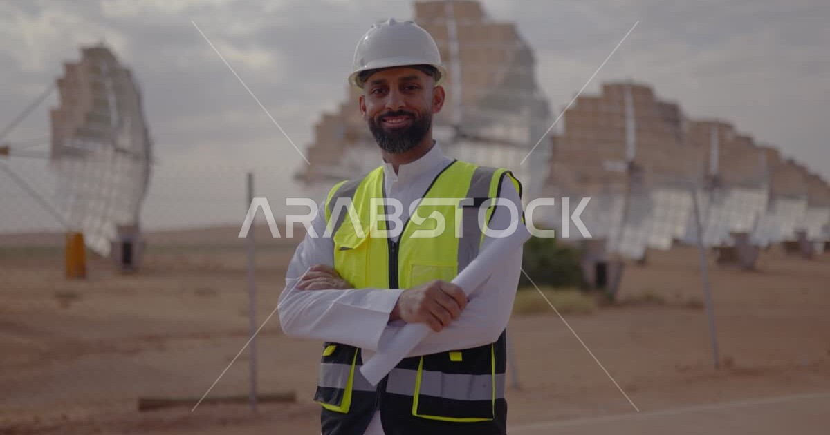 Saudi Arabian Gulf engineer, wearing helmet and protection jacket ...