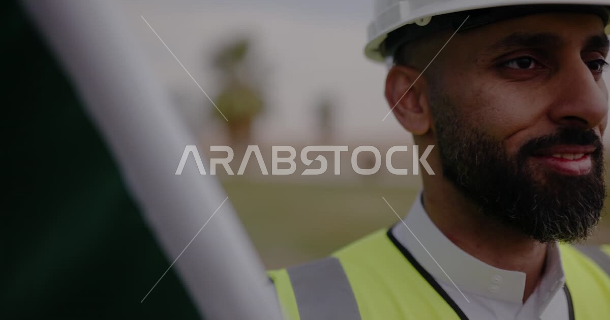 A Saudi Arabian Gulf engineer, wearing a helmet and work protection ...