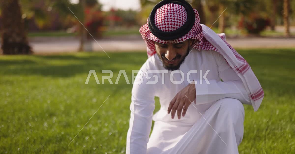 A Saudi Arabian Gulf man spending a good time in a public park, hiking ...