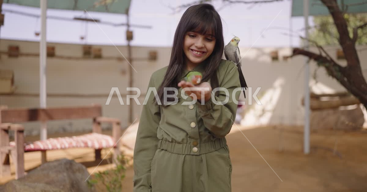A Saudi Arabian Gulf girl spends enjoyable times in a natural bird sanctuary in the Kingdom of ...
