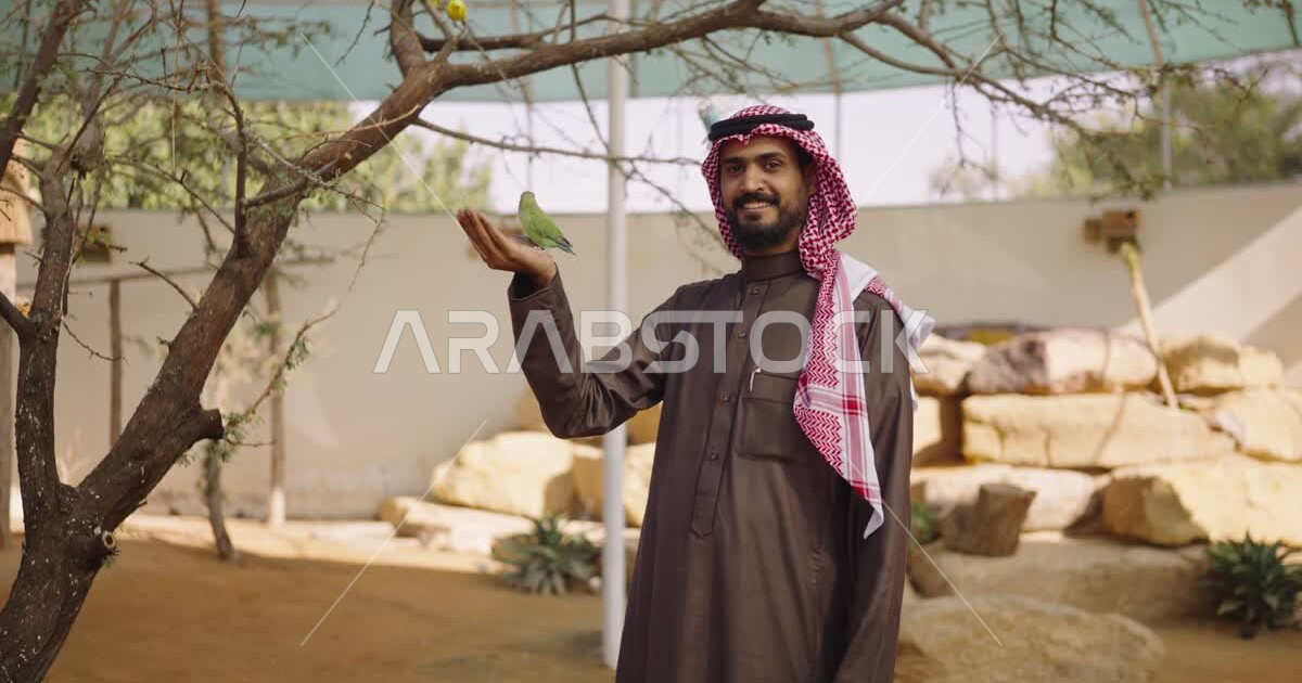 A Saudi Arabian Gulf man looking at the camera and spending fun times ...