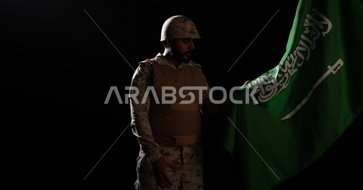 Chroma of a Saudi Arabian Gulf security man in military dress, carrying ...