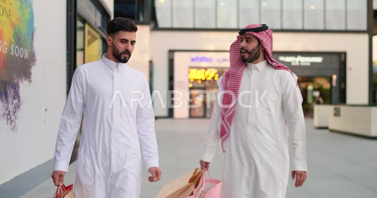 Saudi Arab Gulf friends strolling in The Zone complex in Riyadh in the ...