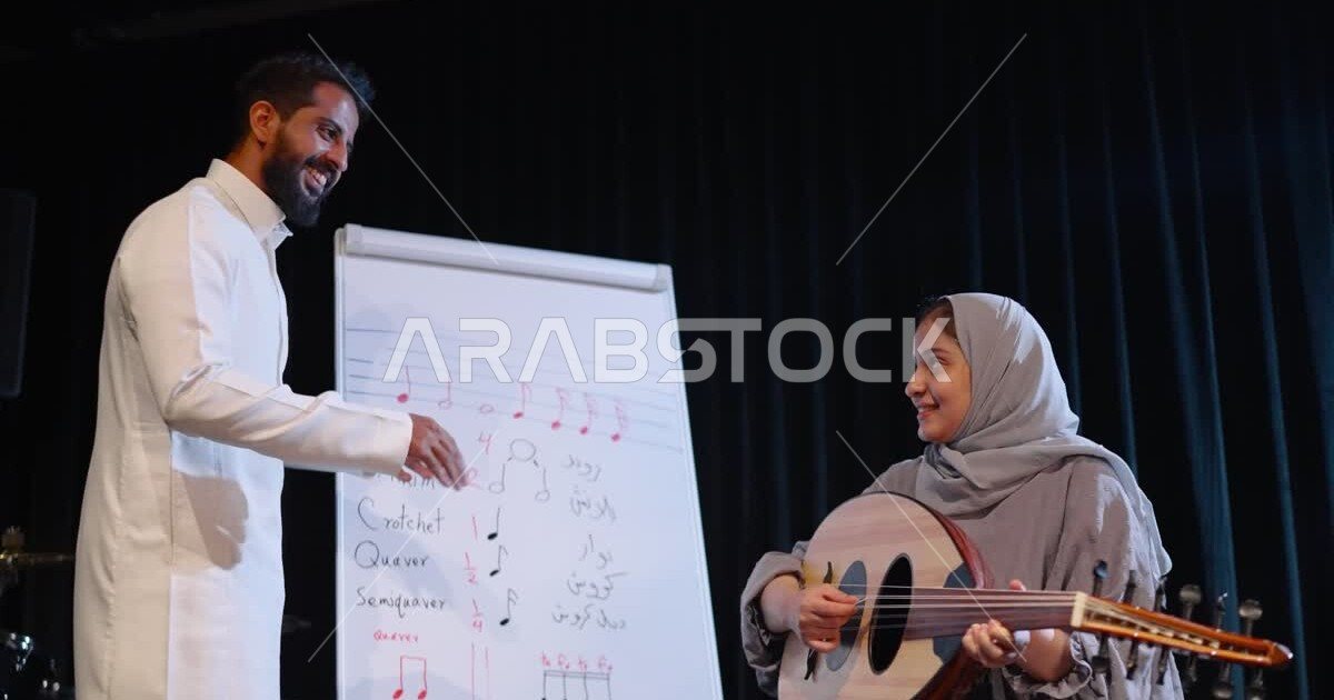 A Saudi Arabian Gulf man giving music lessons, a Saudi Arab woman ...