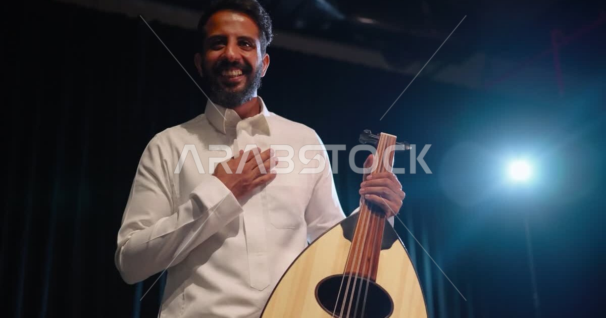 A close-up of a Saudi Arabian Gulf man making introductory gestures ...