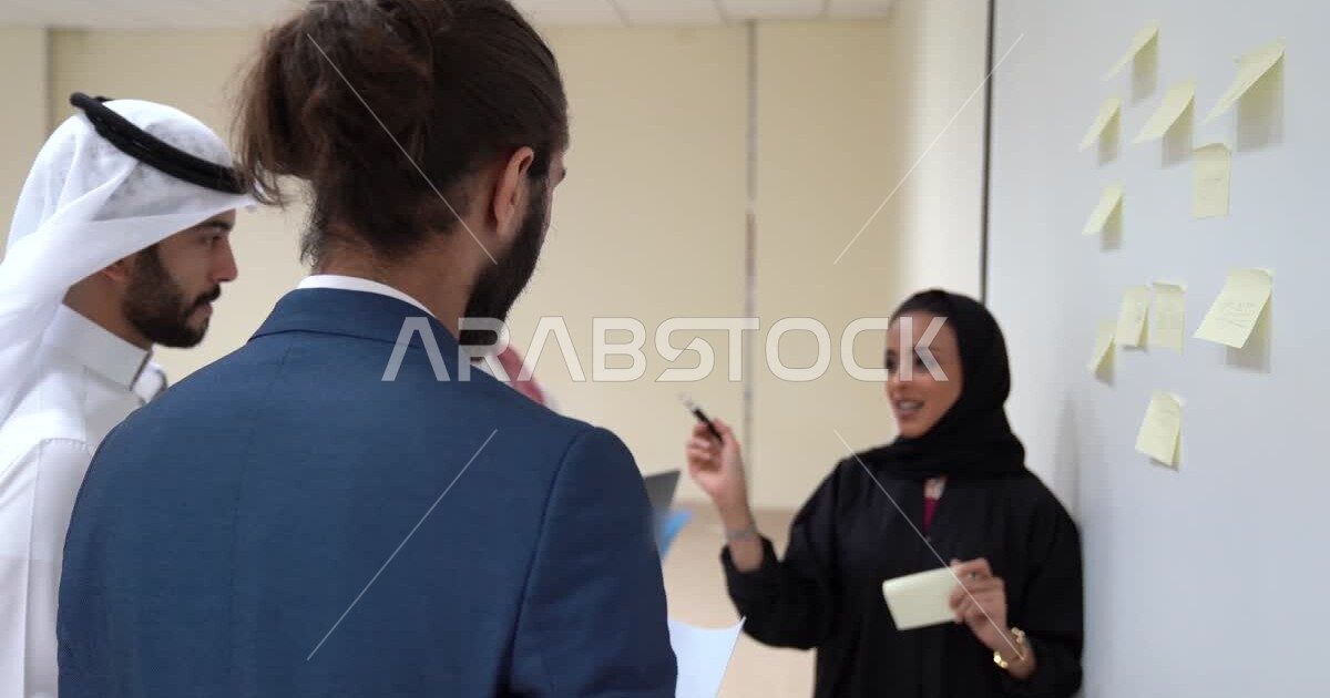 A Saudi Arabian Gulf university professor explains to her students the ...