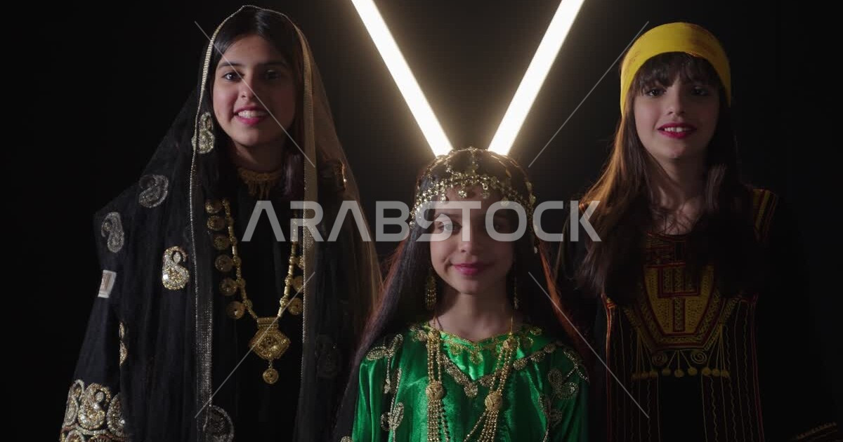 Chroma, a group of Saudi Arab girls, wearing the traditional Saudi folk ...