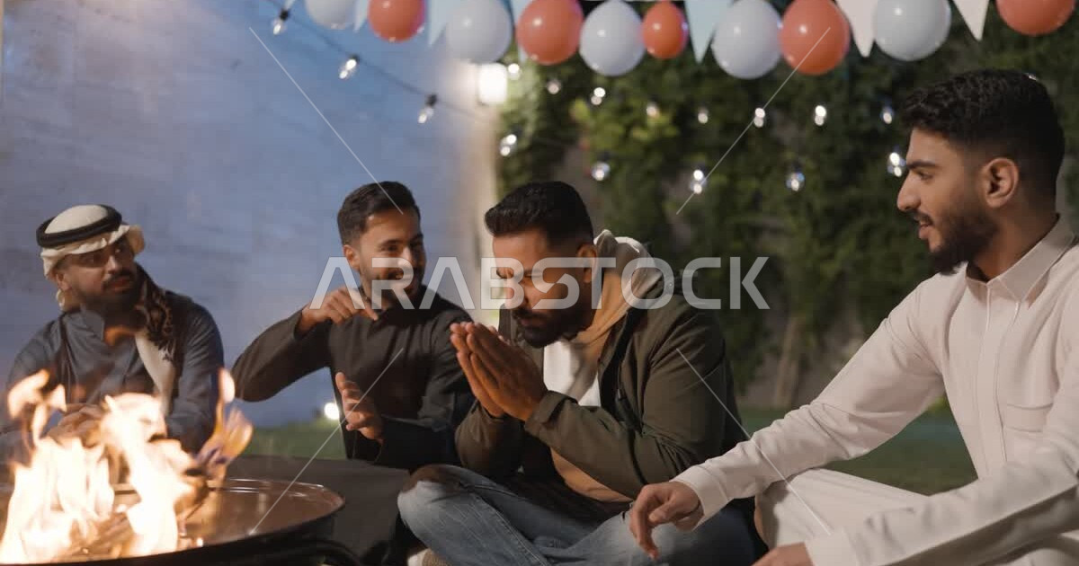 A close-up of the flames burning in the fireplace, Saudi Gulf youth ...