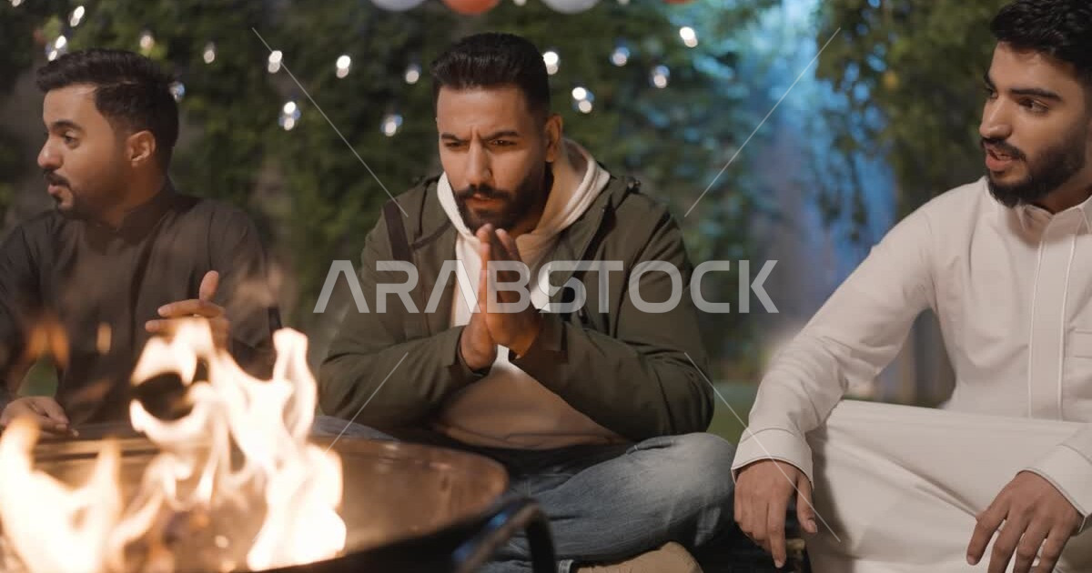 A close-up of the flames burning in the fireplace, Saudi Gulf youth ...