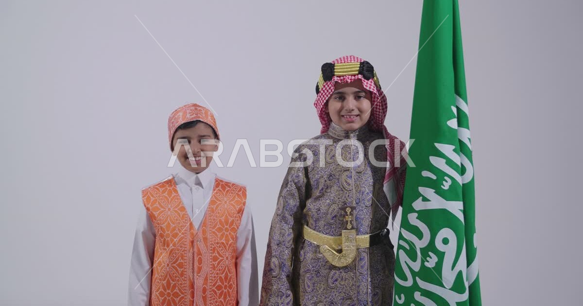 Chroma, two Saudi Arabian Gulf boys, wearing the traditional Saudi folk ...