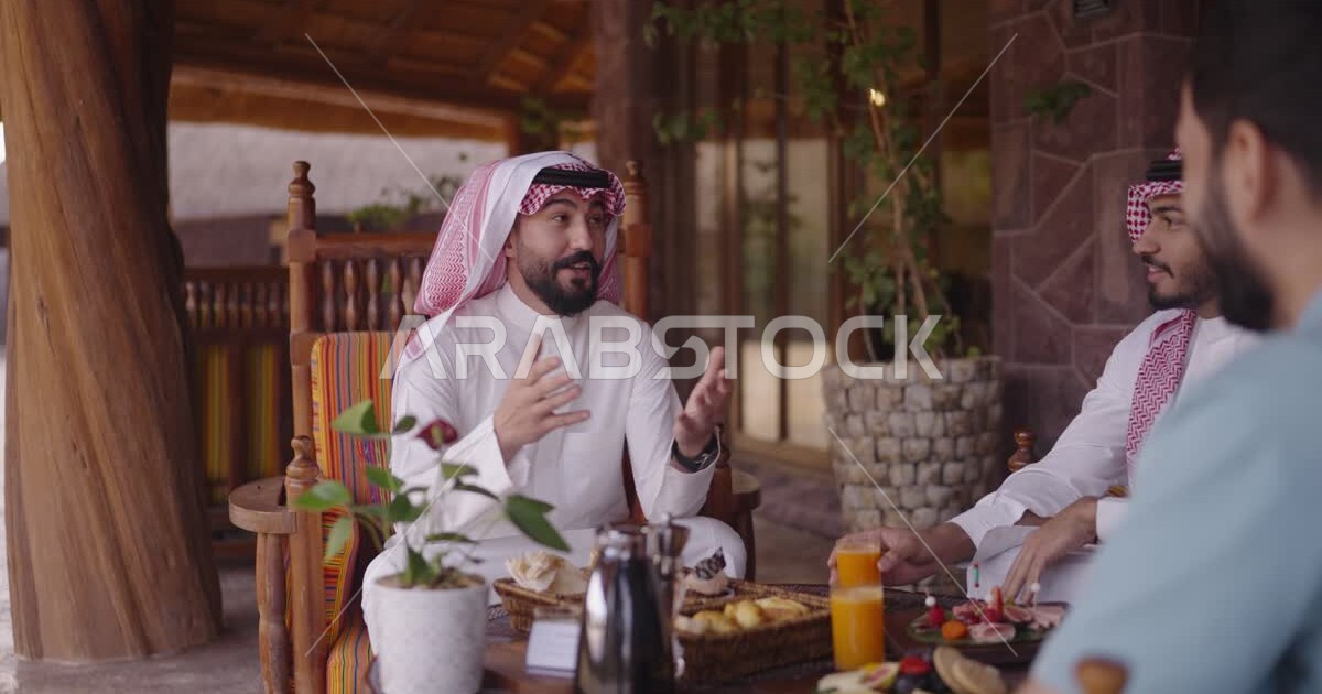Saudi Gulf Arab youth sitting in a cafe and enjoying the exchange of ...