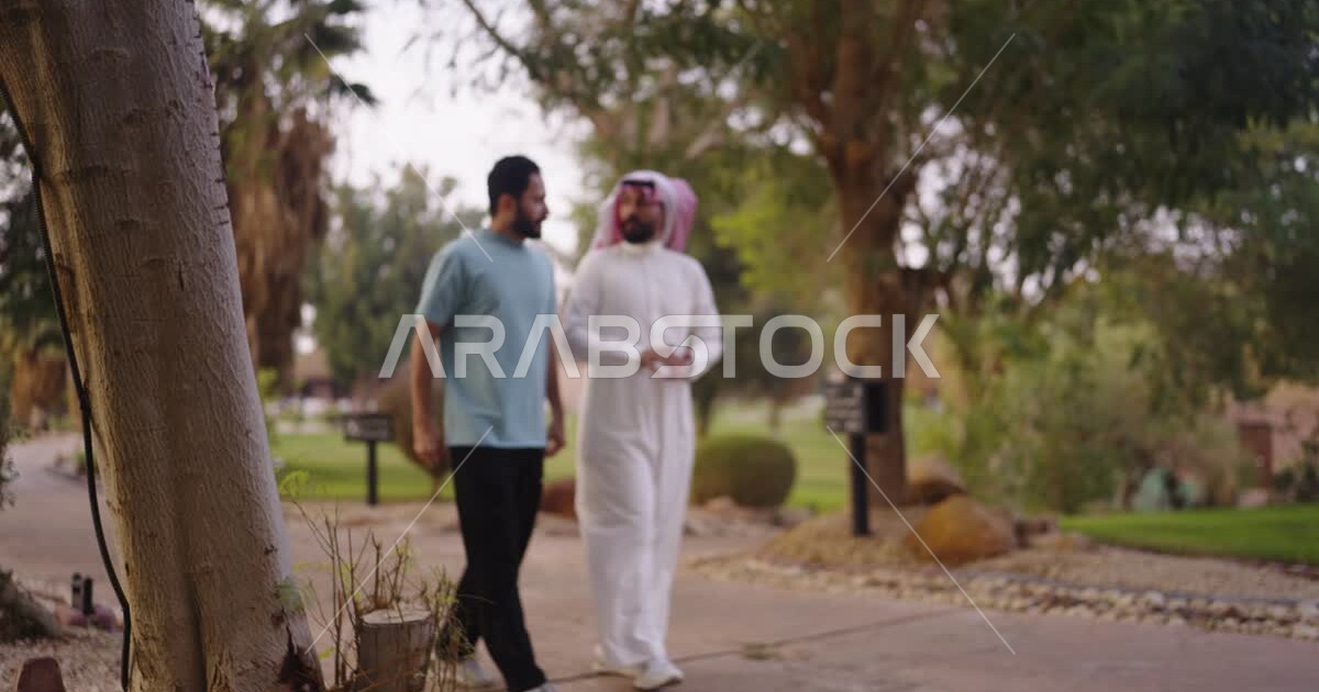 Two Saudi Arabian Gulf friends touring in one of the entertainment ...