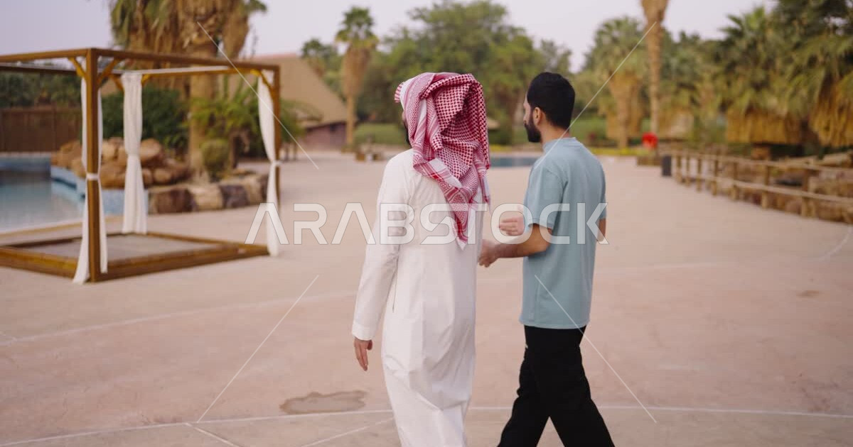 Two Saudi Arabian Gulf friends touring in one of the entertainment ...