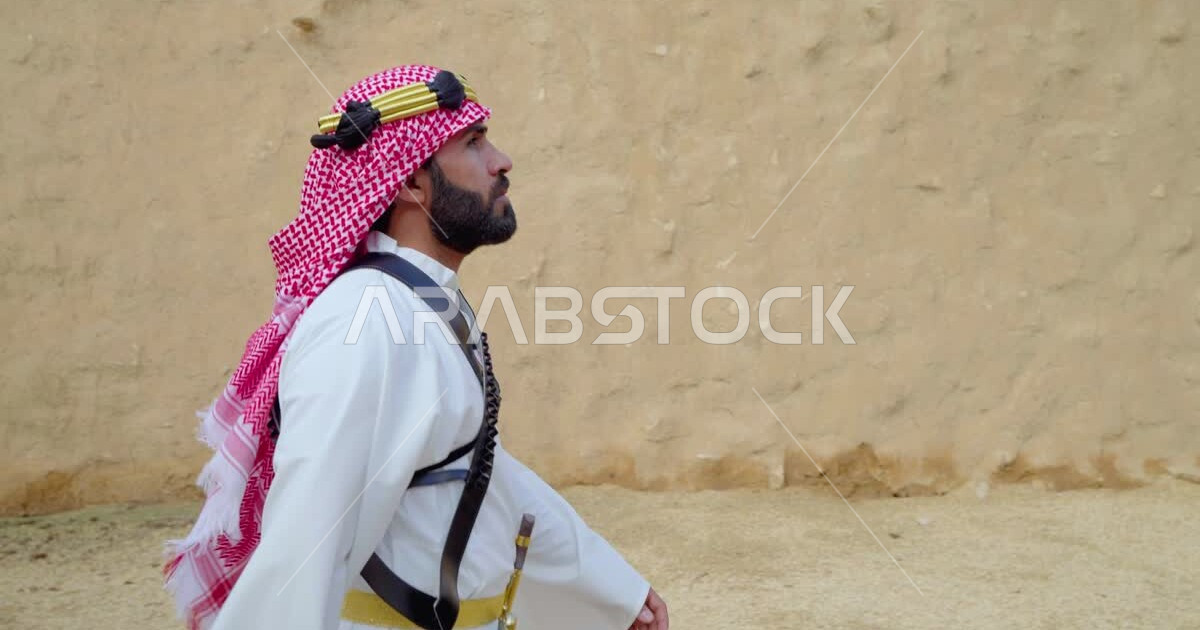 A Saudi Arabian Gulf man wearing the traditional Saudi folk dress, the ...