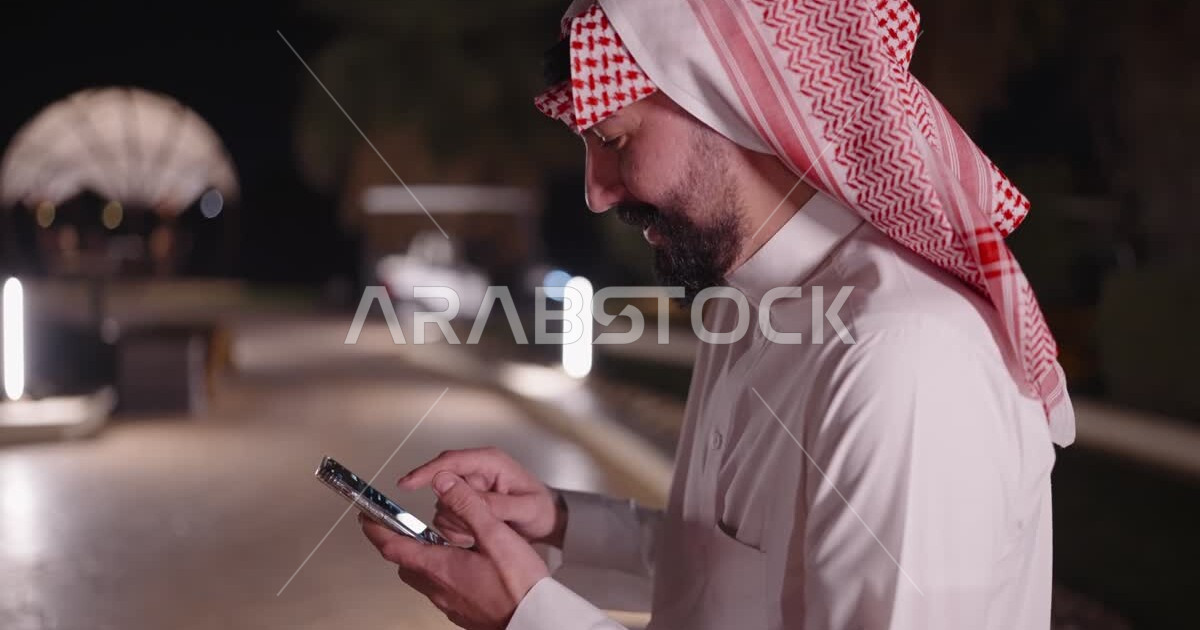 A close-up of a Saudi Arab Gulf man wearing traditional Saudi dress ...