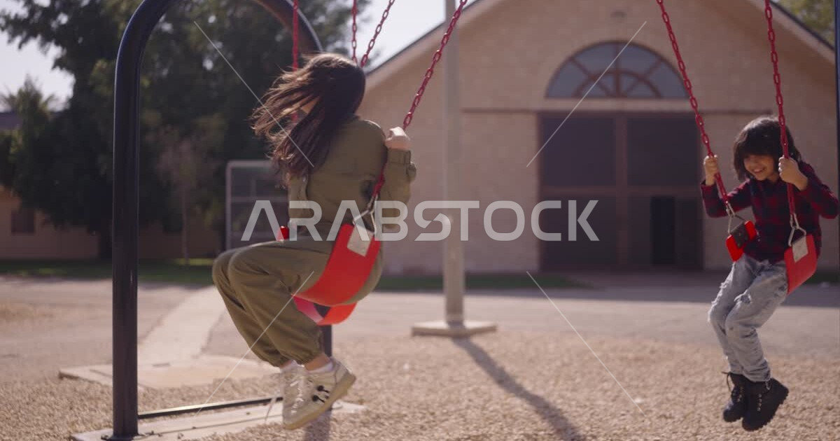 A Saudi Gulf Arab boy and girl in one of the recreational parks in ...
