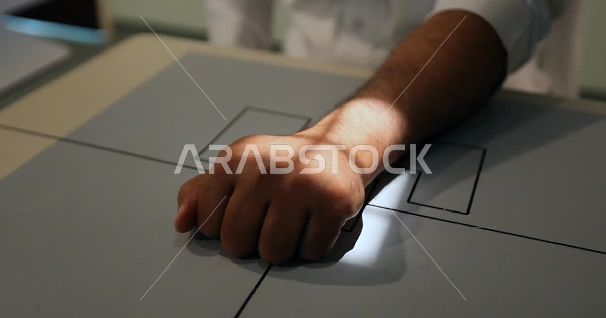Close-up of a man's hand under an x-ray machine, modern advanced ...