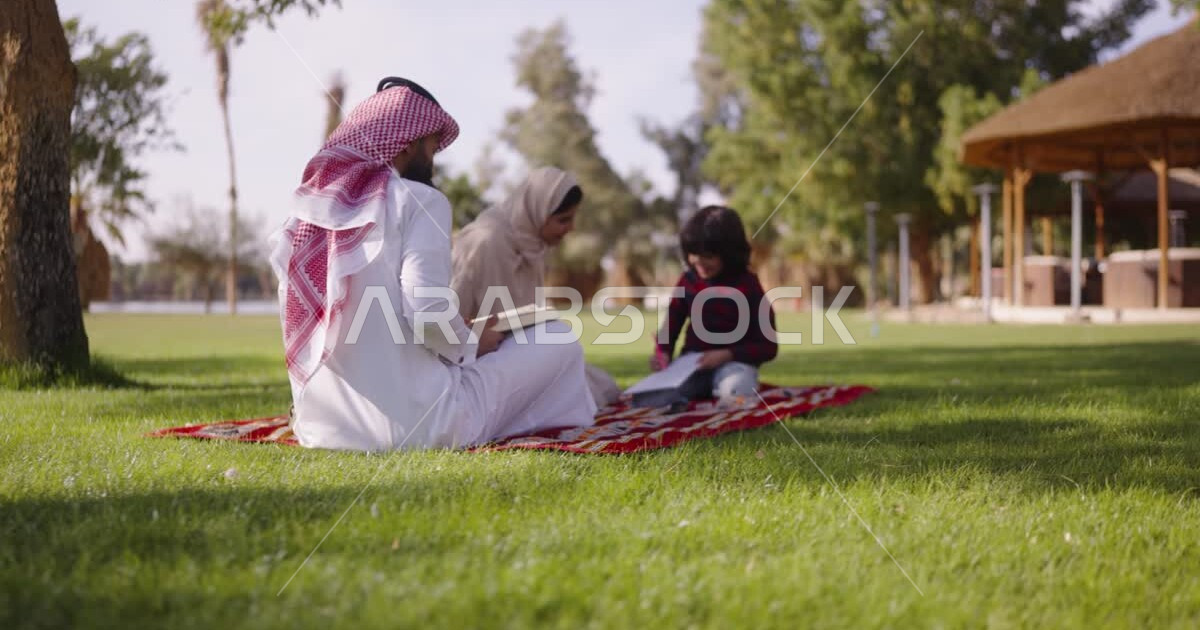 A Saudi Gulf Arab family spends fun times in a park in Saudi Arabia, a ...