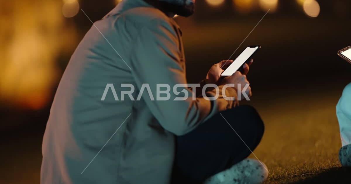 Two Saudi Arabian Gulf men, the use of mobile phones, the use of modern ...