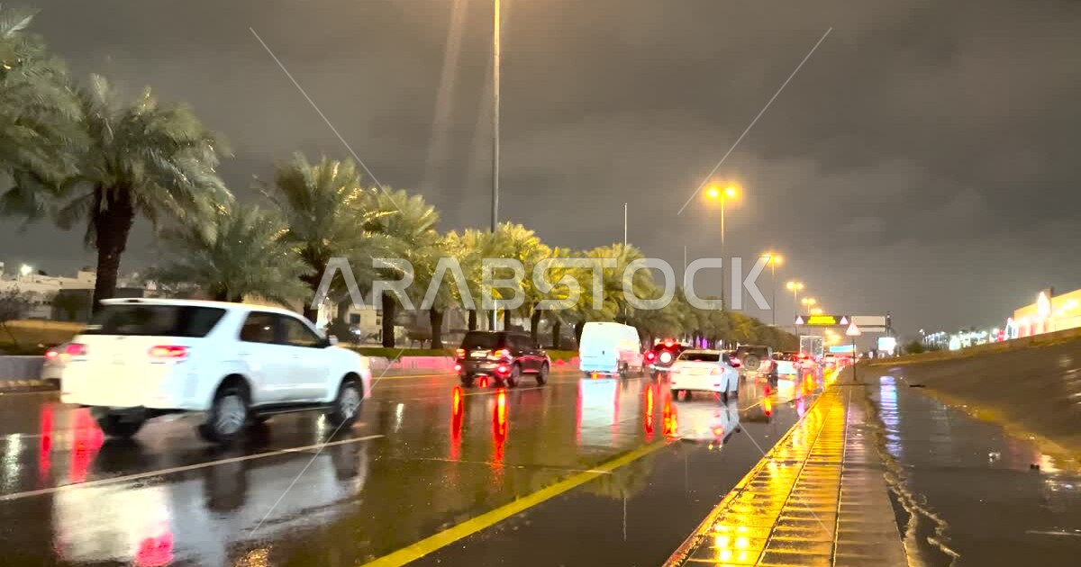 Traffic in the streets of Riyadh, Saudi Arabia at night, rainy weather ...