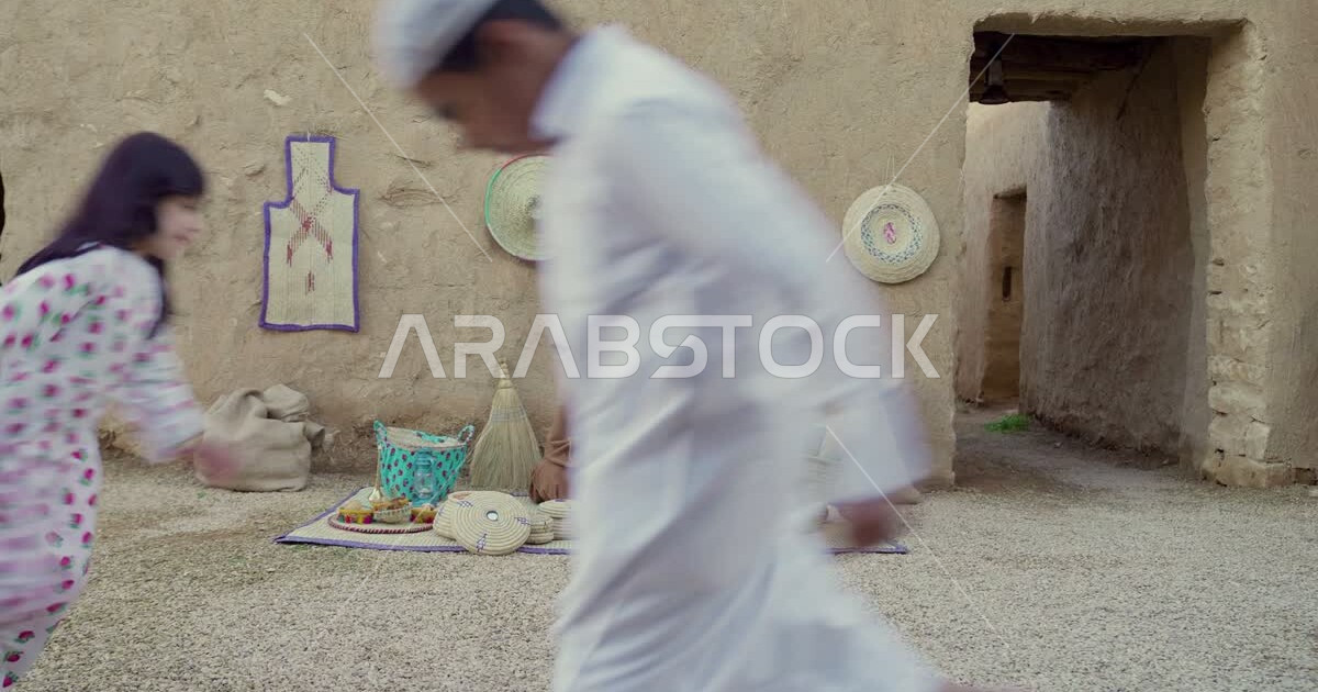 A Saudi Arabian Gulf man using an old copper mill, works and ...