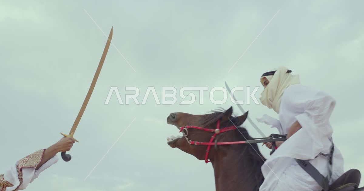 Two Saudi Arabian Gulf knights riding horses in the desert and jousting, using historical Saudi ...
