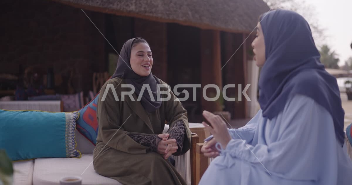 Two Saudi Arab Gulf women sitting in one of the public parks in the ...