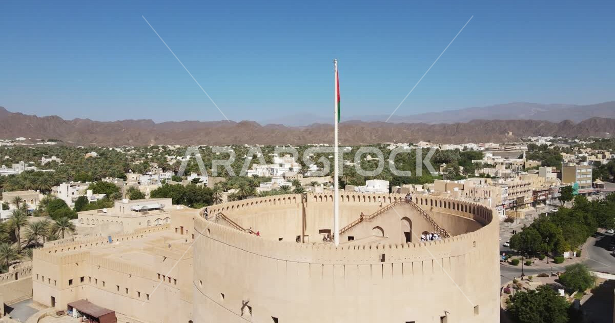 Drone photography of Nizwa Fort in the Sultanate of Oman, green nature ...
