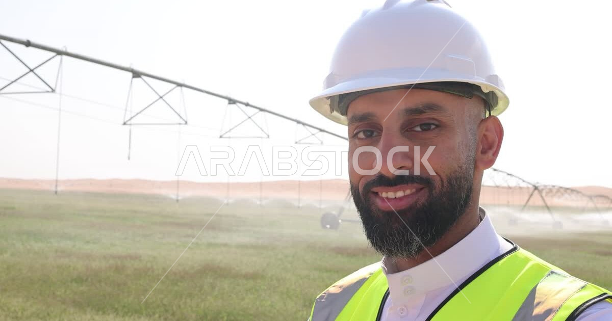 A Saudi Arab Gulf agricultural engineer, looking at the camera, an ...