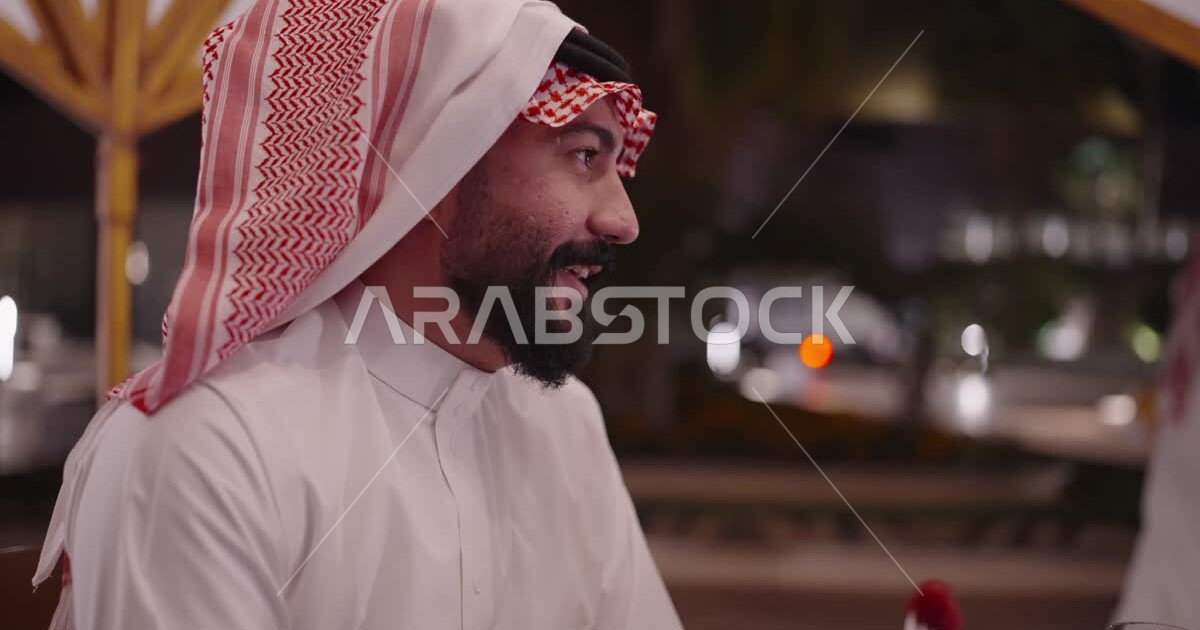 A Saudi Arab Gulf couple enjoying an exchange of conversation in a ...