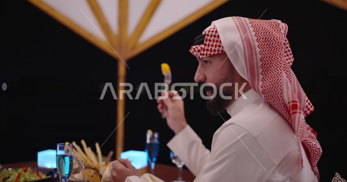 A Saudi Arab Gulf couple enjoying an exchange of conversation in a ...