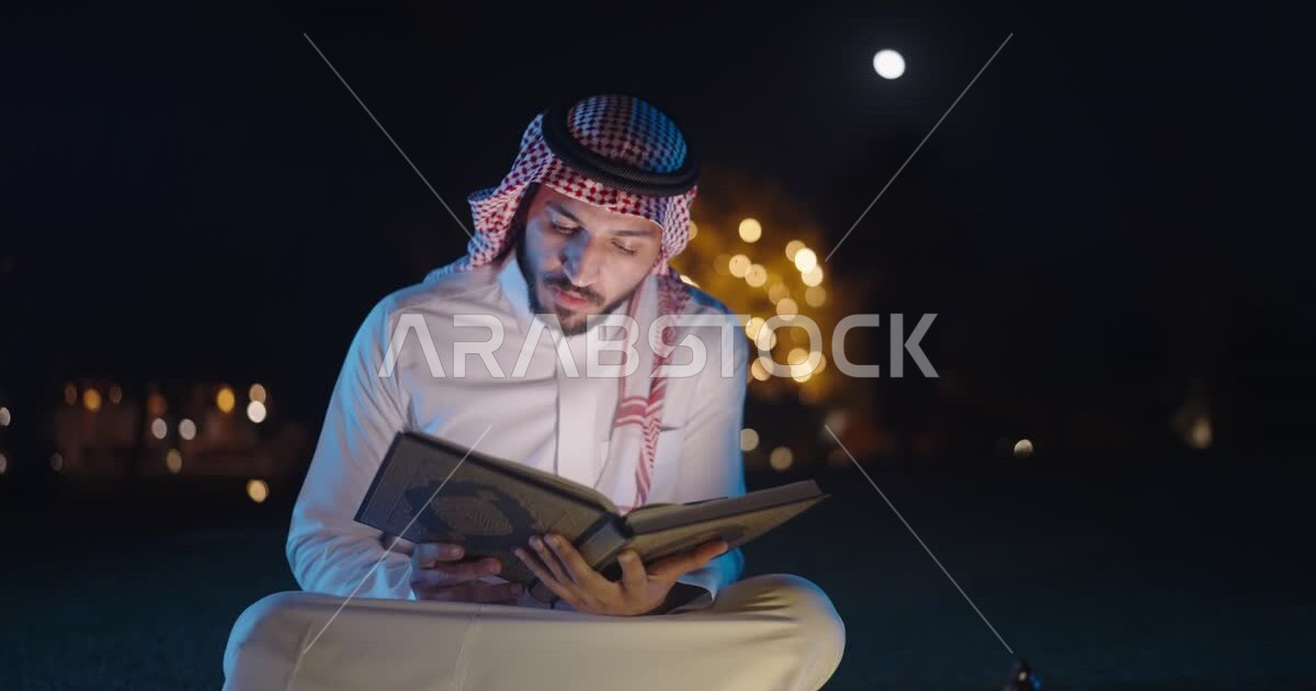 A Saudi Gulf Arab man reading the Holy Qur’an, the Holy Qur’an, Ramadan ...