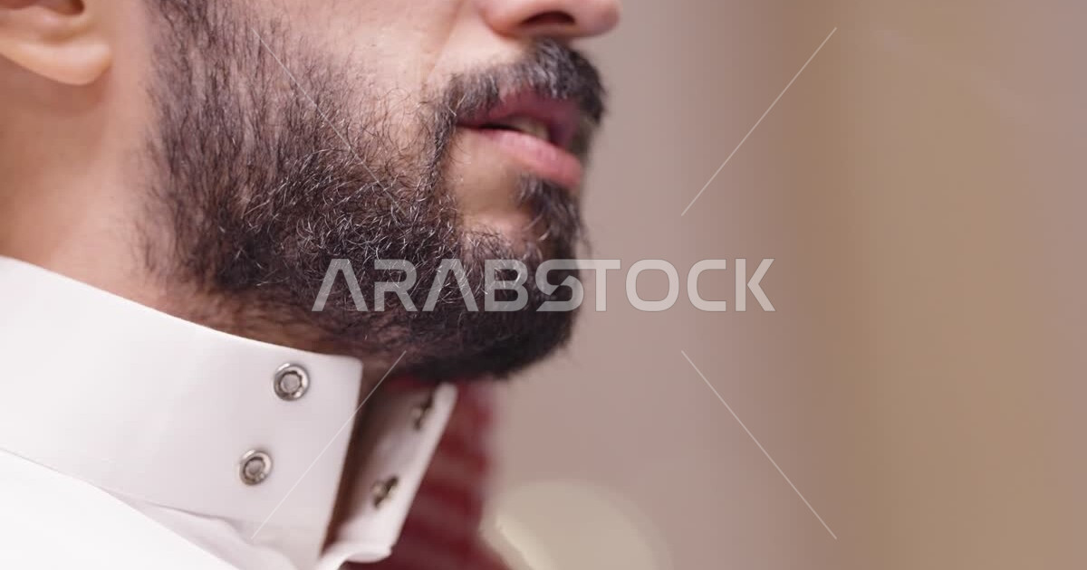 Close-up of a Saudi Arabian Gulf man smoking cigarettes, addiction to ...