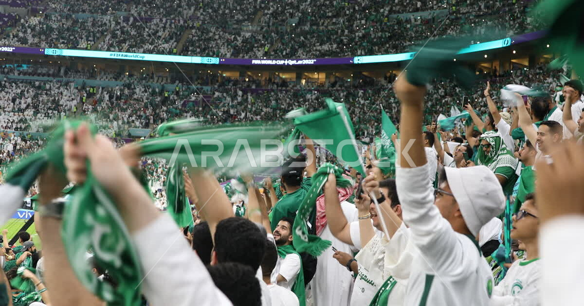 The fans of the Saudi national team cheer and encourage the Saudi ...