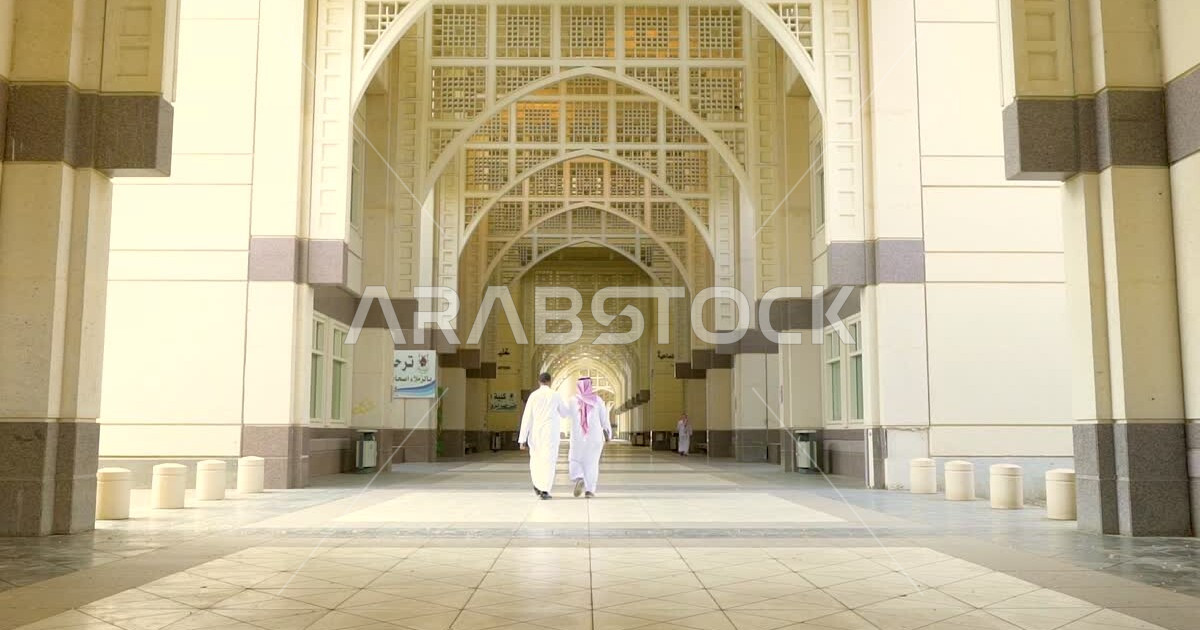 A young Saudi man walks around the campus, an upscale and modern ...