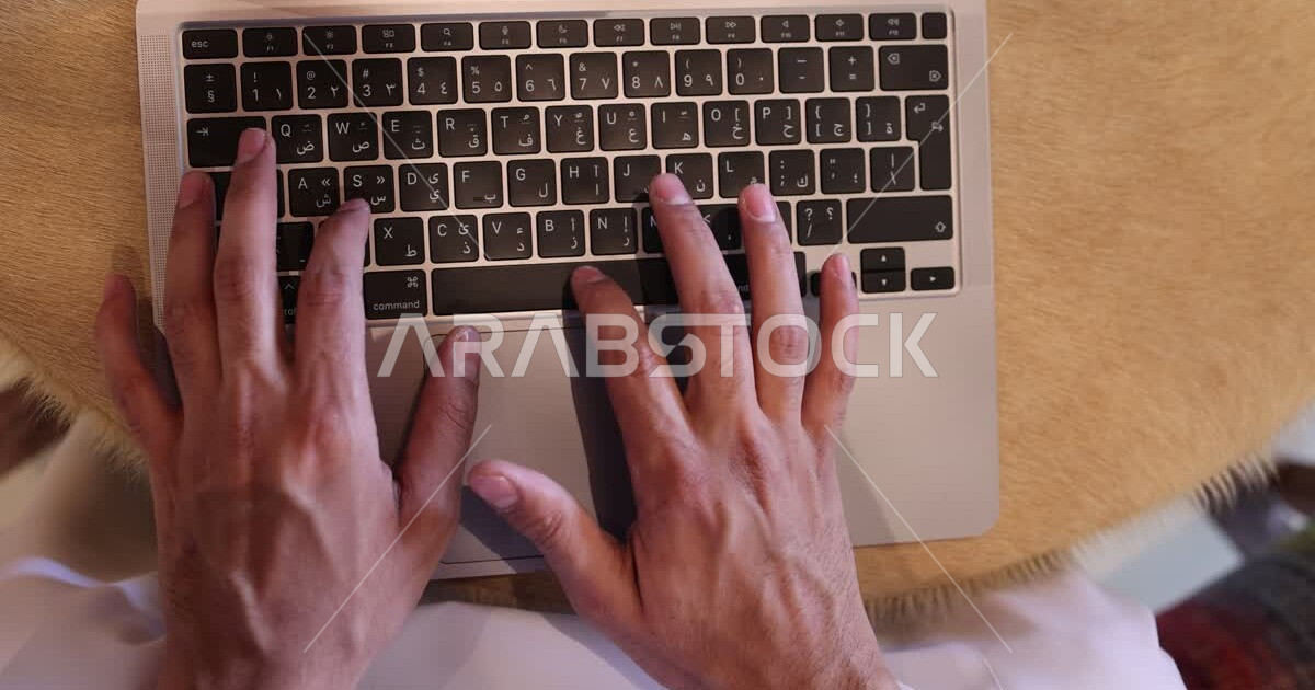 Close-up of a man's hand, using a laptop to complete tasks, surfing the ...