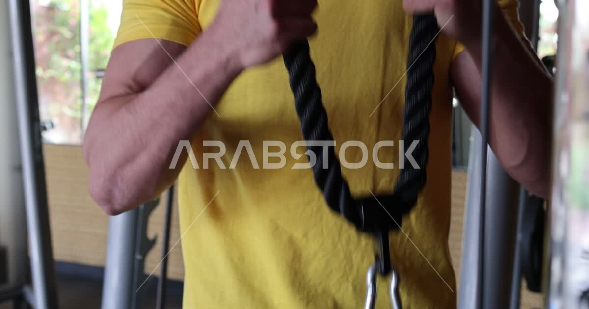 Saudi Arab Gulf man in the sports club, wearing sports clothes, doing ...