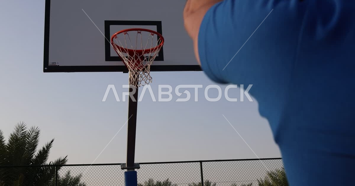 Close-up of a Saudi Arab Gulf man, playing basketball, sports ...