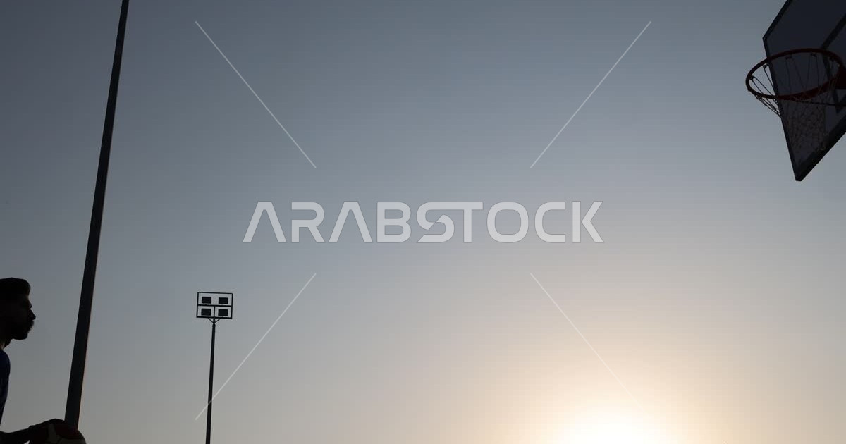 Close-up of a Saudi Arab Gulf man, playing basketball, sports ...