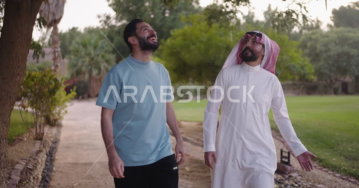 Two Saudi Arabian Gulf men in a recreational resort, parks and ...