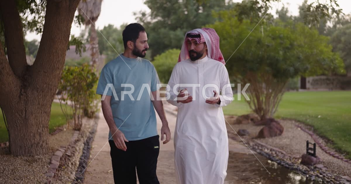 Two Saudi Arabian Gulf men in a recreational resort, parks and ...