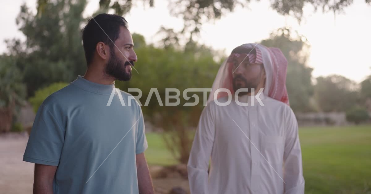 Two Saudi Arabian Gulf men in a recreational resort, parks and ...