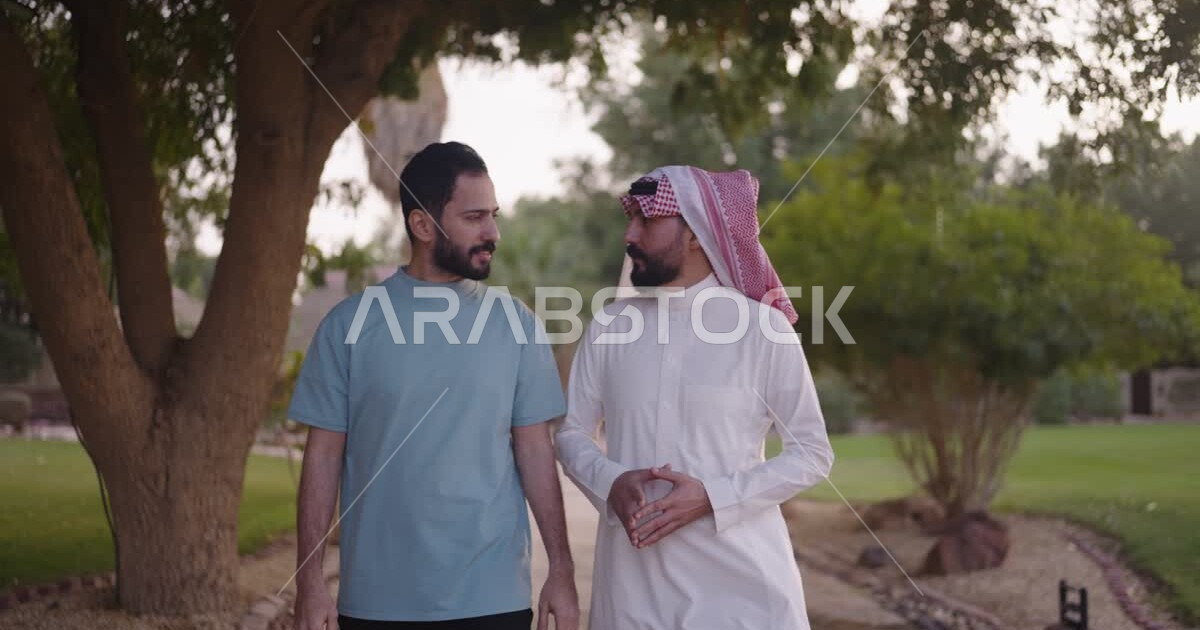 Two Saudi Arabian Gulf men in a recreational resort, parks and ...